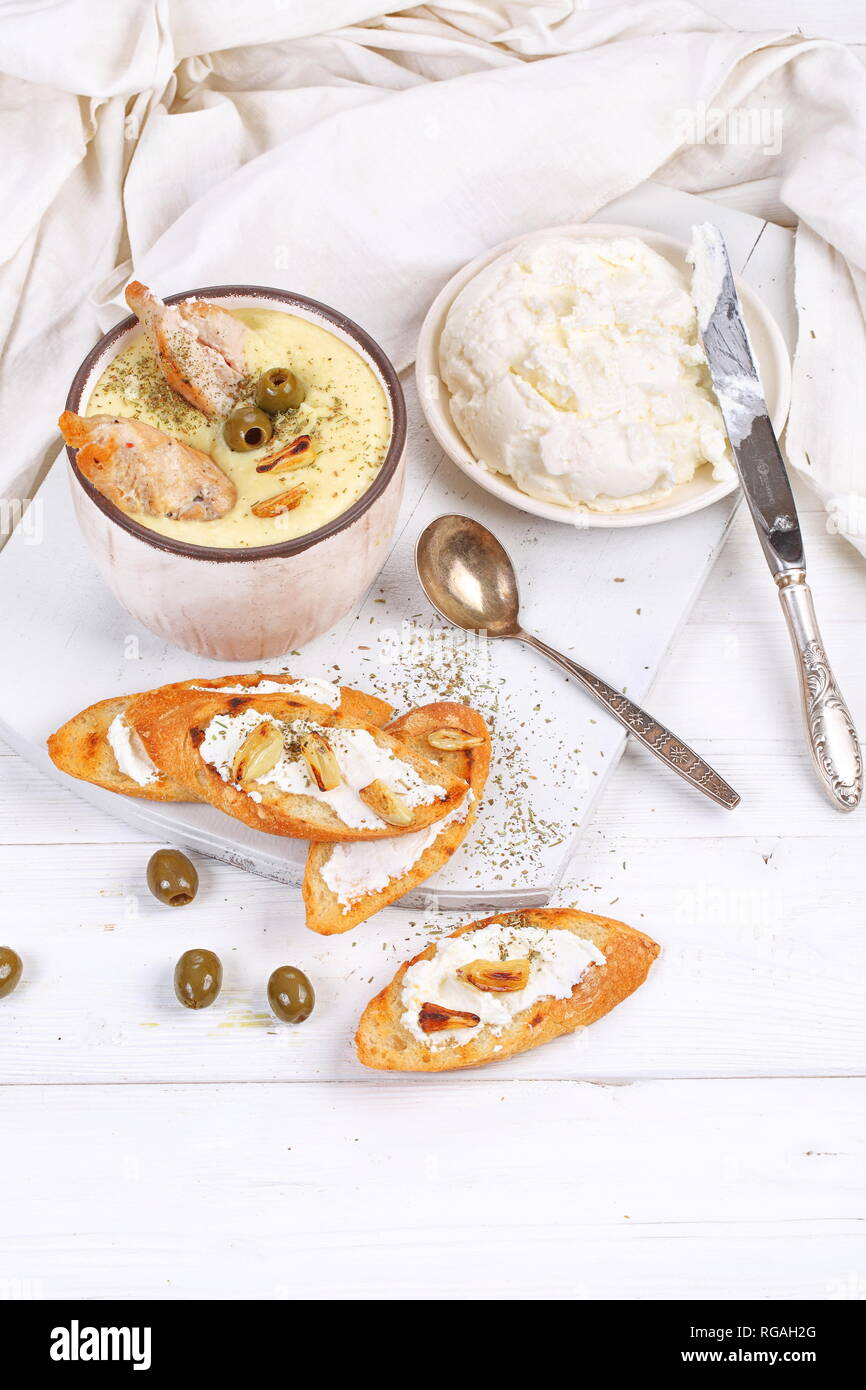 French puree soup with parsnip, soft cheese baguette Stock Photo - Alamy