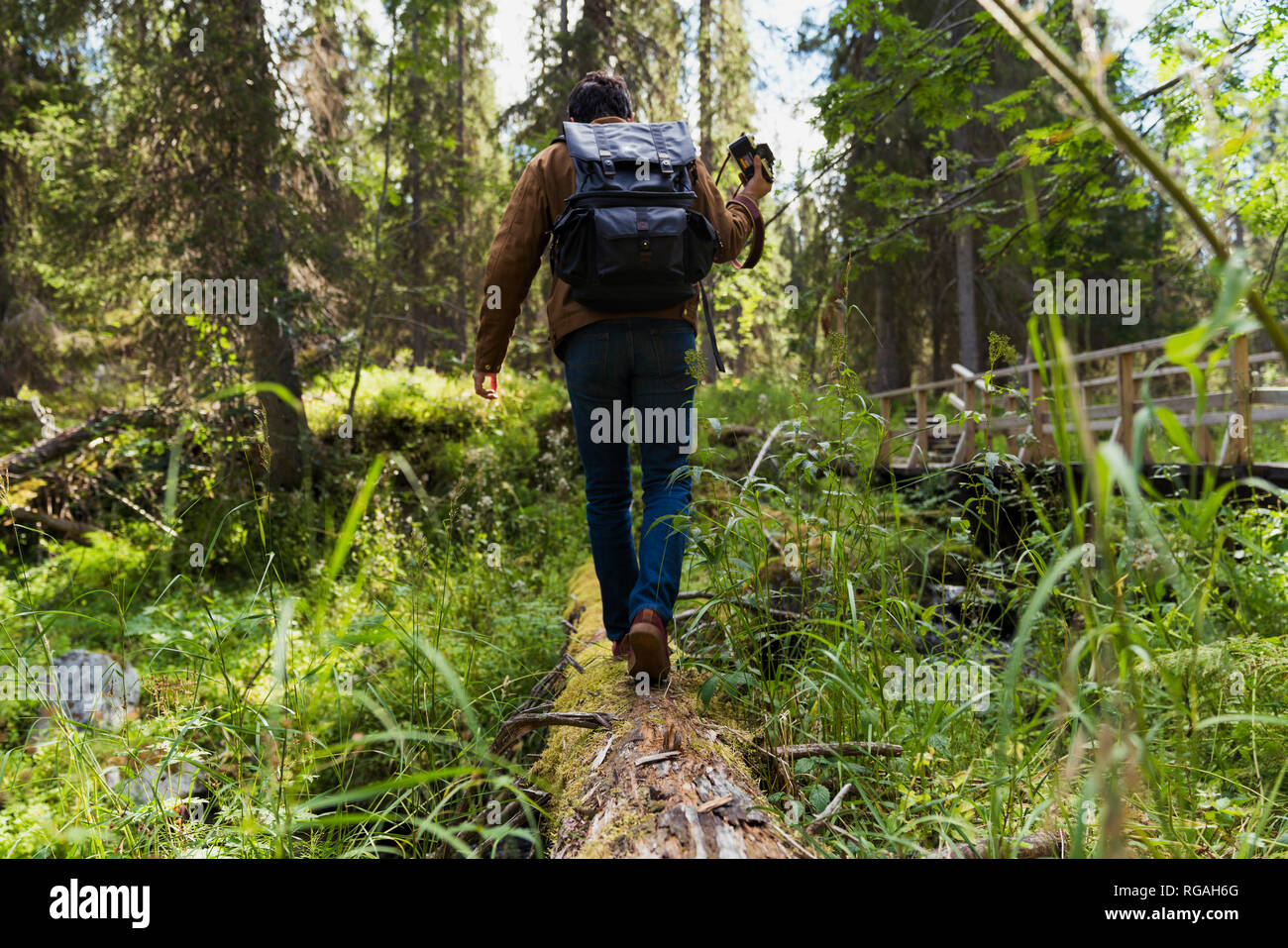 Man walking on log in hi-res stock photography and images - Alamy