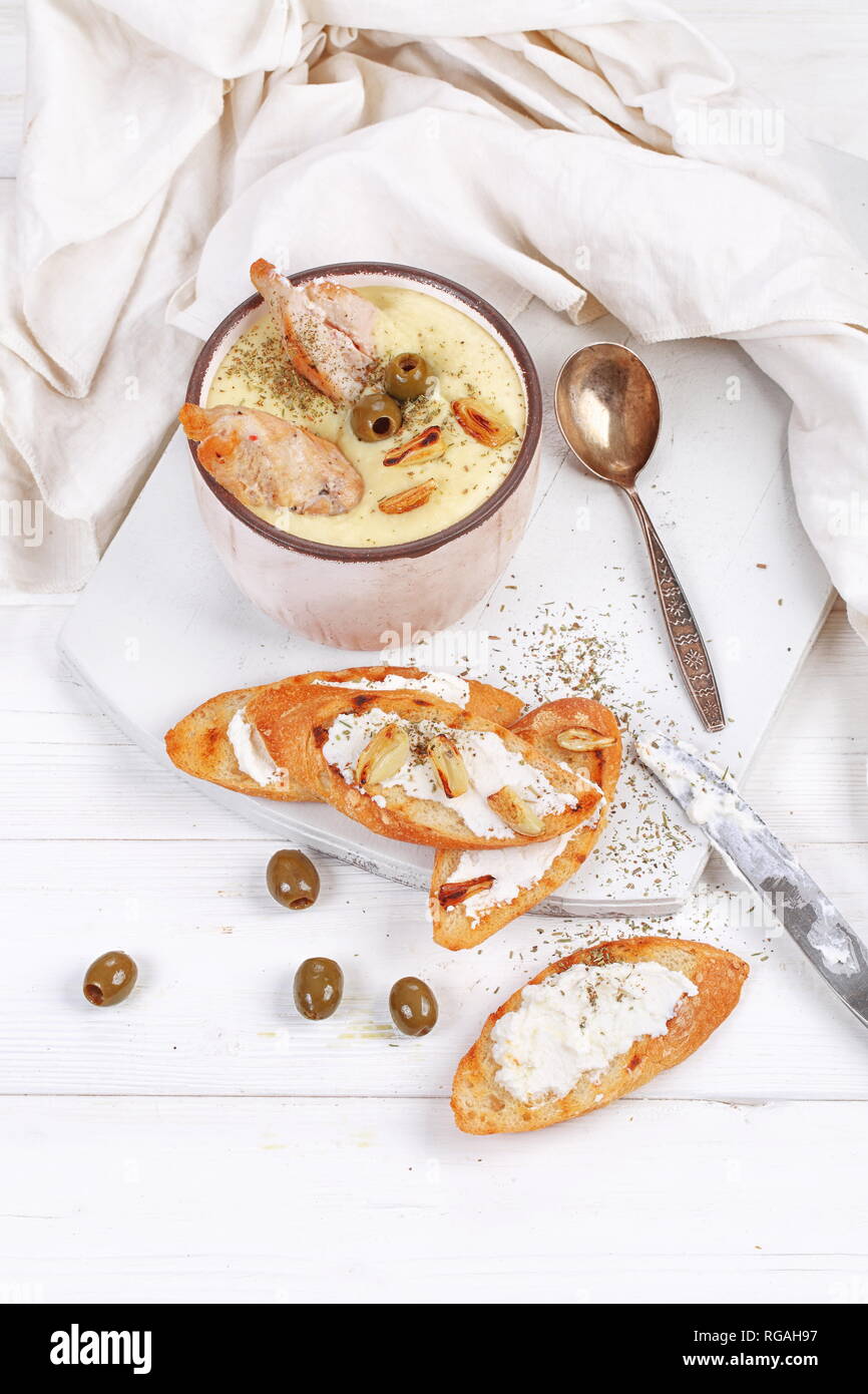French puree soup with parsnip, soft cheese baguette Stock Photo - Alamy