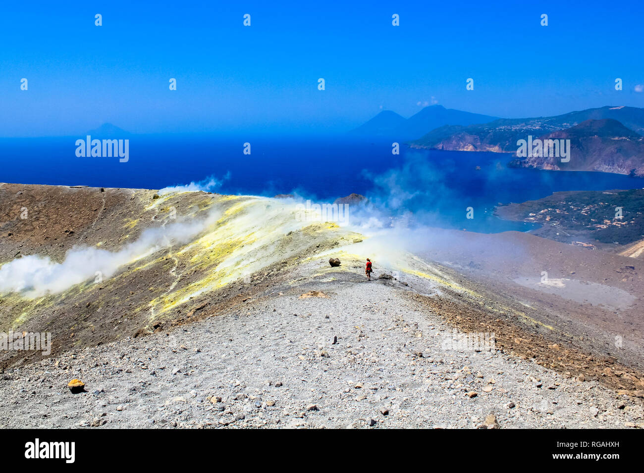 The crater of a volcano at Vulcano Island in Italy attracts tourists ...