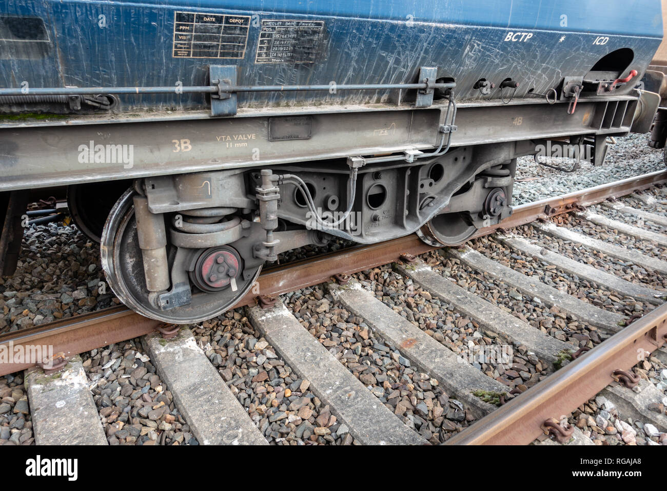 Freight train with derailed wheel set Stock Photo - Alamy
