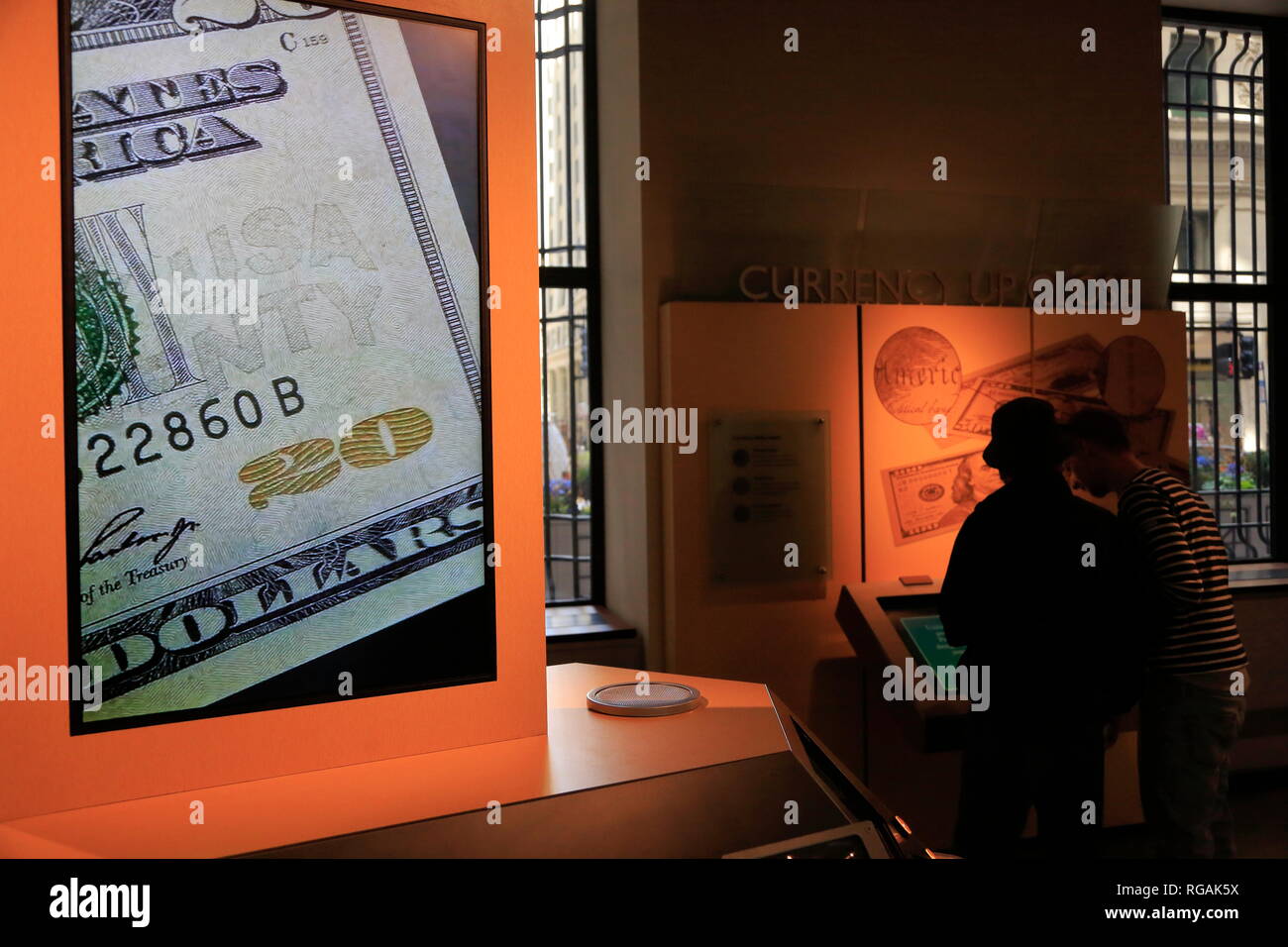 A screen showing detailed security features in US dollar paper currency ...