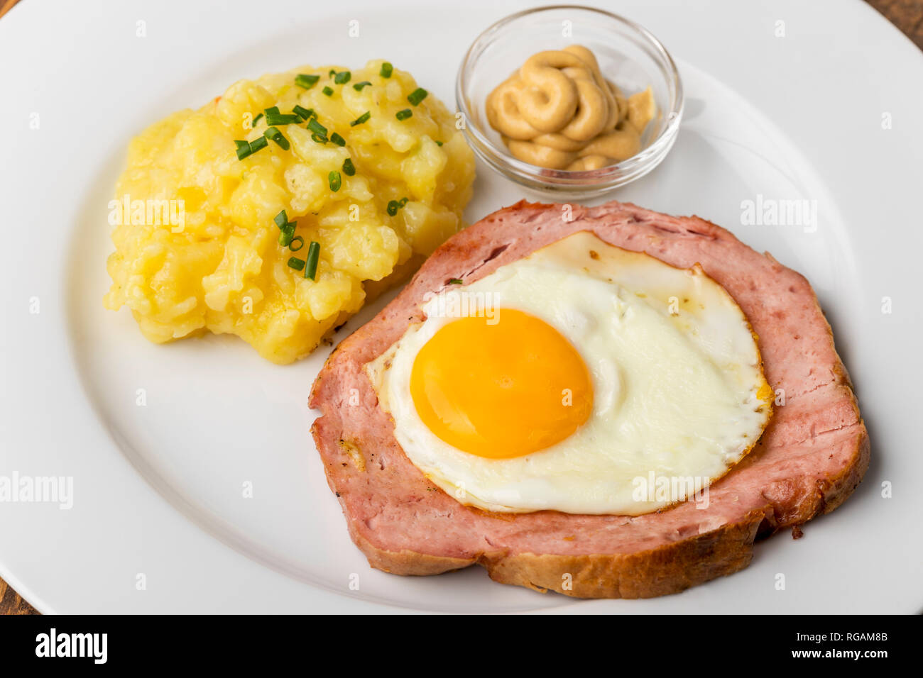a typical bavarian snack the leberkaese with potato salad Stock Photo ...