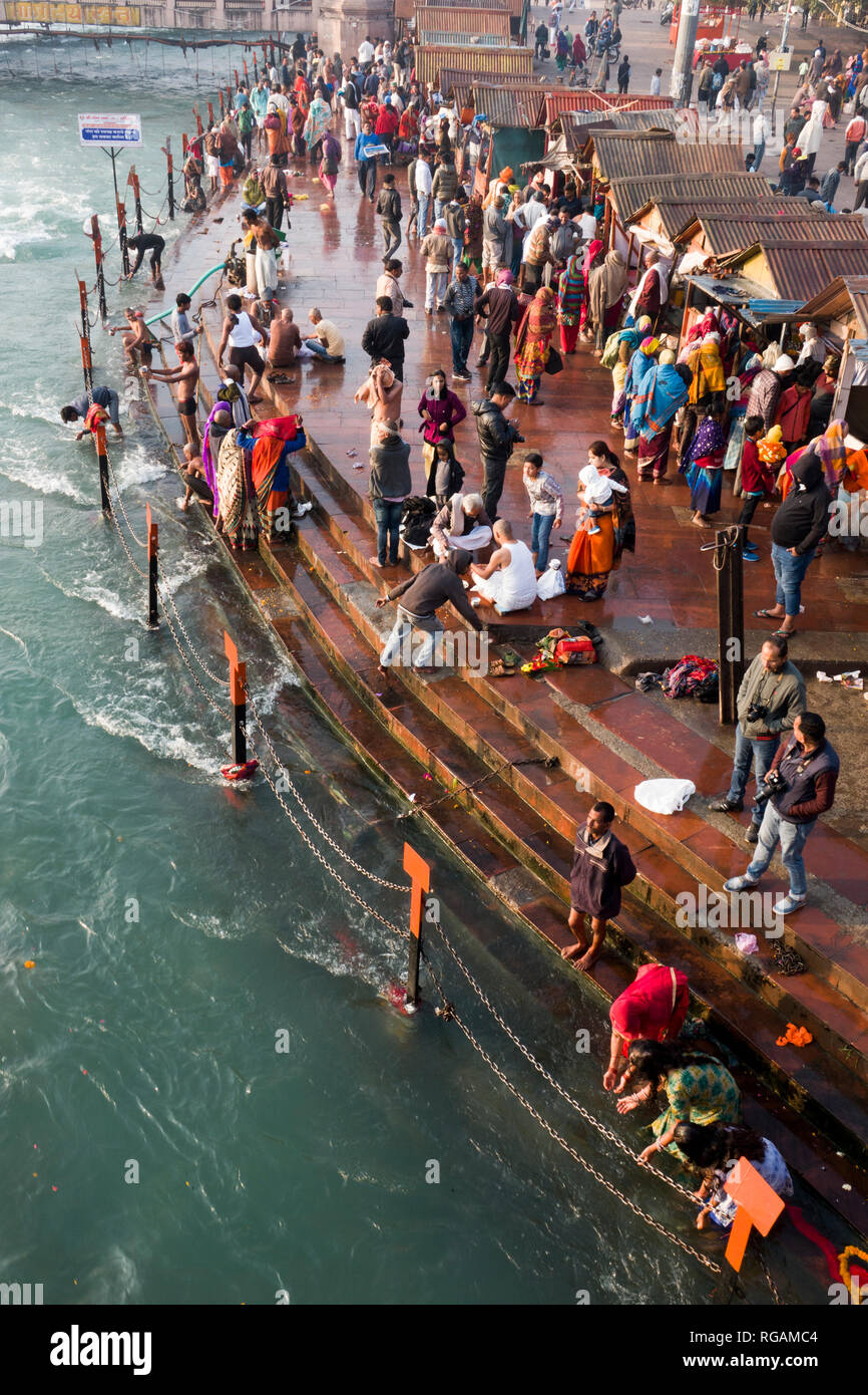 Worshipers bathing in the river Ganges at the holy city of Haridwar ...