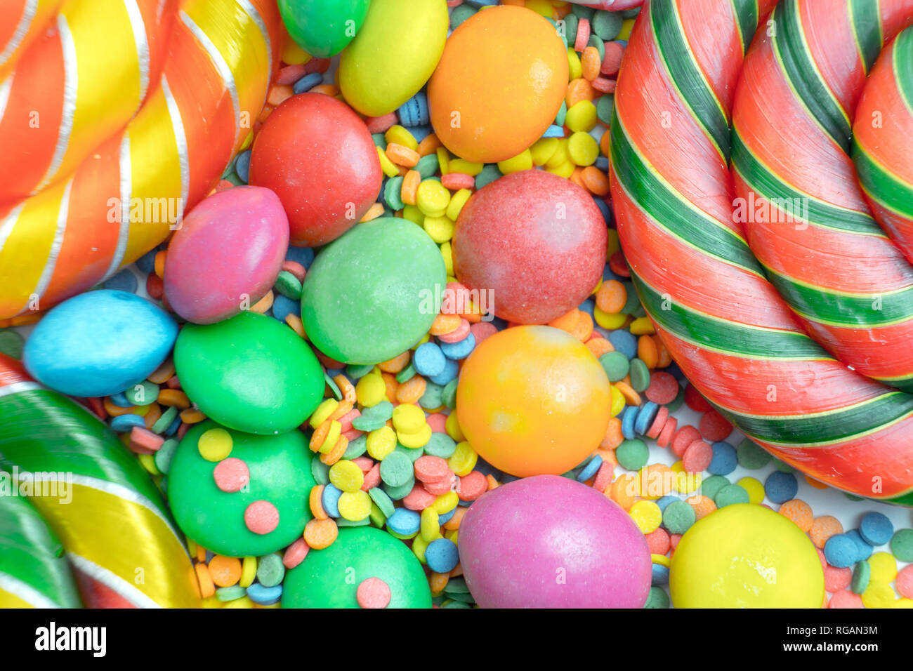 background from multicolored assortment of delicious candy top view ...