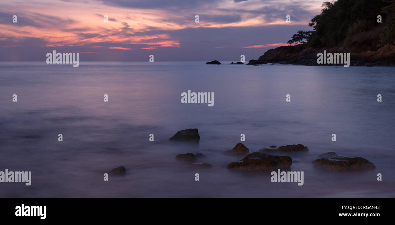 Flat sea with rocks hi-res stock photography and images - Alamy