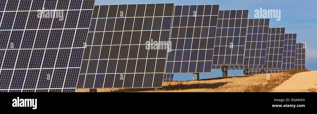 Panoramic web banner of photovoltaic solar panels providing alternative ...