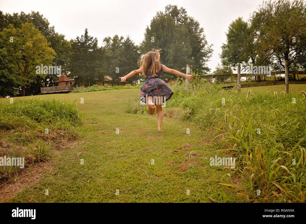 Girl in dress playing hi-res stock photography and images - Alamy