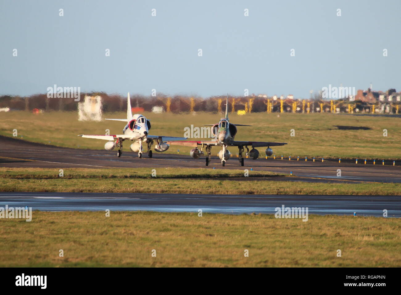 Two Douglas A-4N Skyhawks operated by BAE Systems Flight Systems, taxi ...