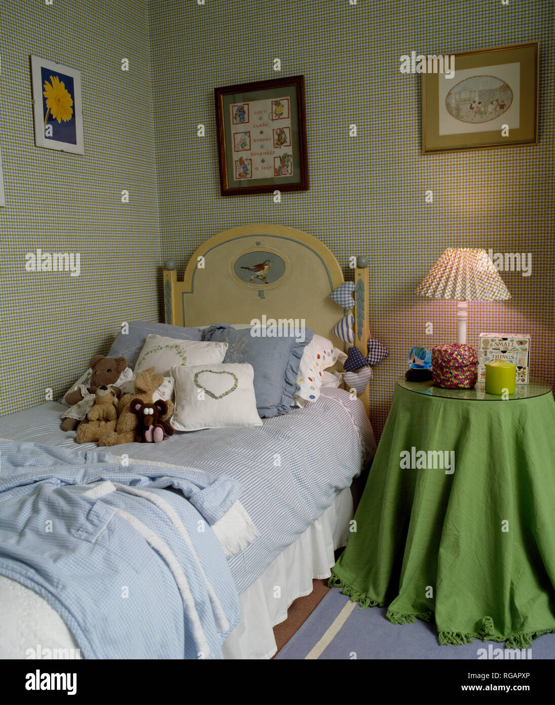 Checked wallpaper in bedroom with single bed Stock Photo - Alamy