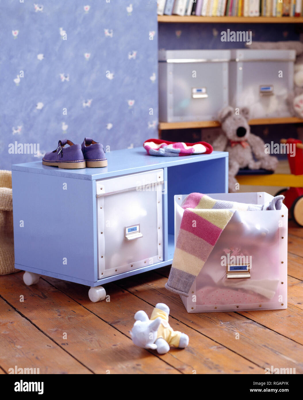 Pull-out storage bags in renovated chest on casters in child's room ...