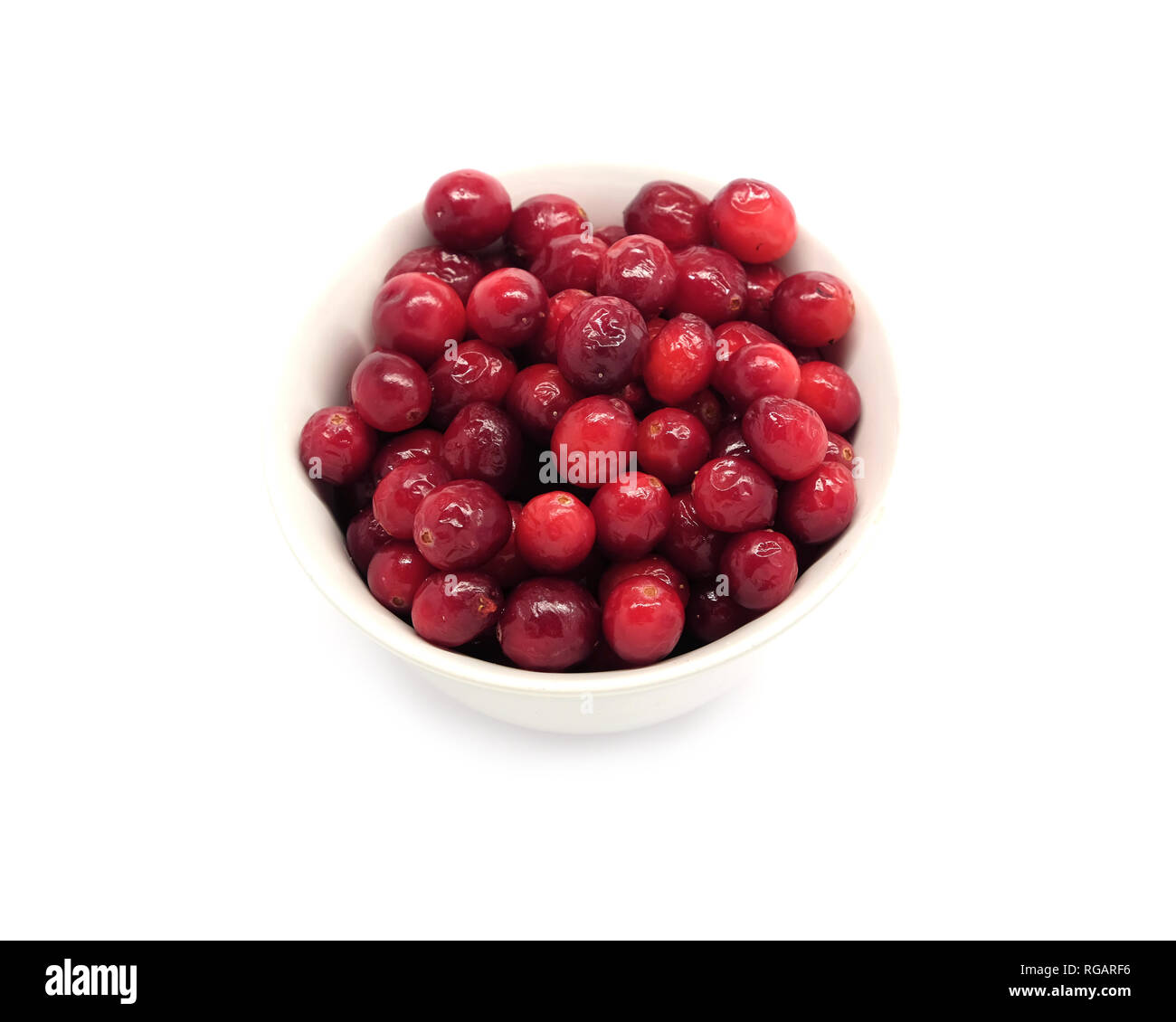 Cranberries in round white bowl isolated on white background indoor ...
