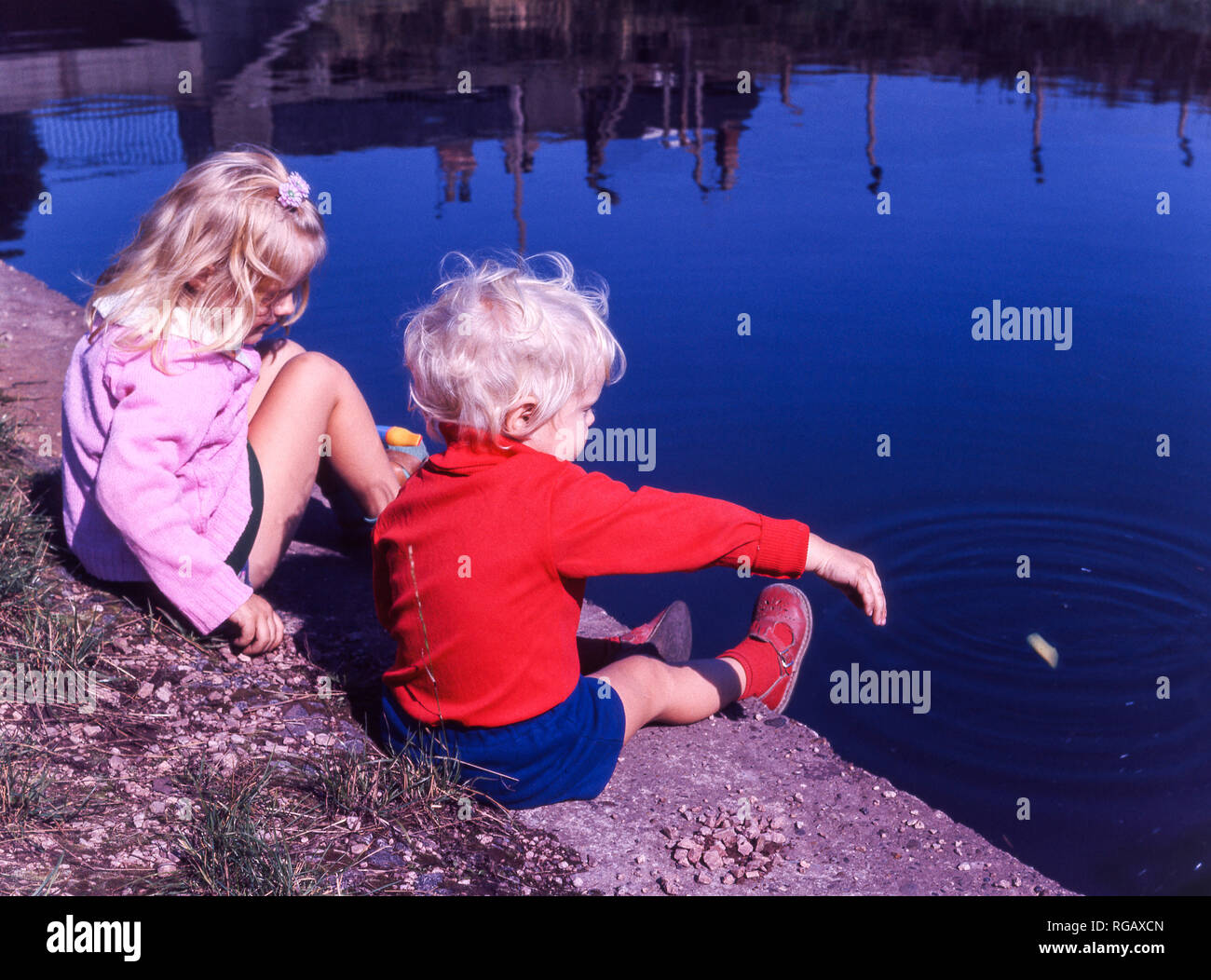 Children throwing stones hi-res stock photography and images - Alamy