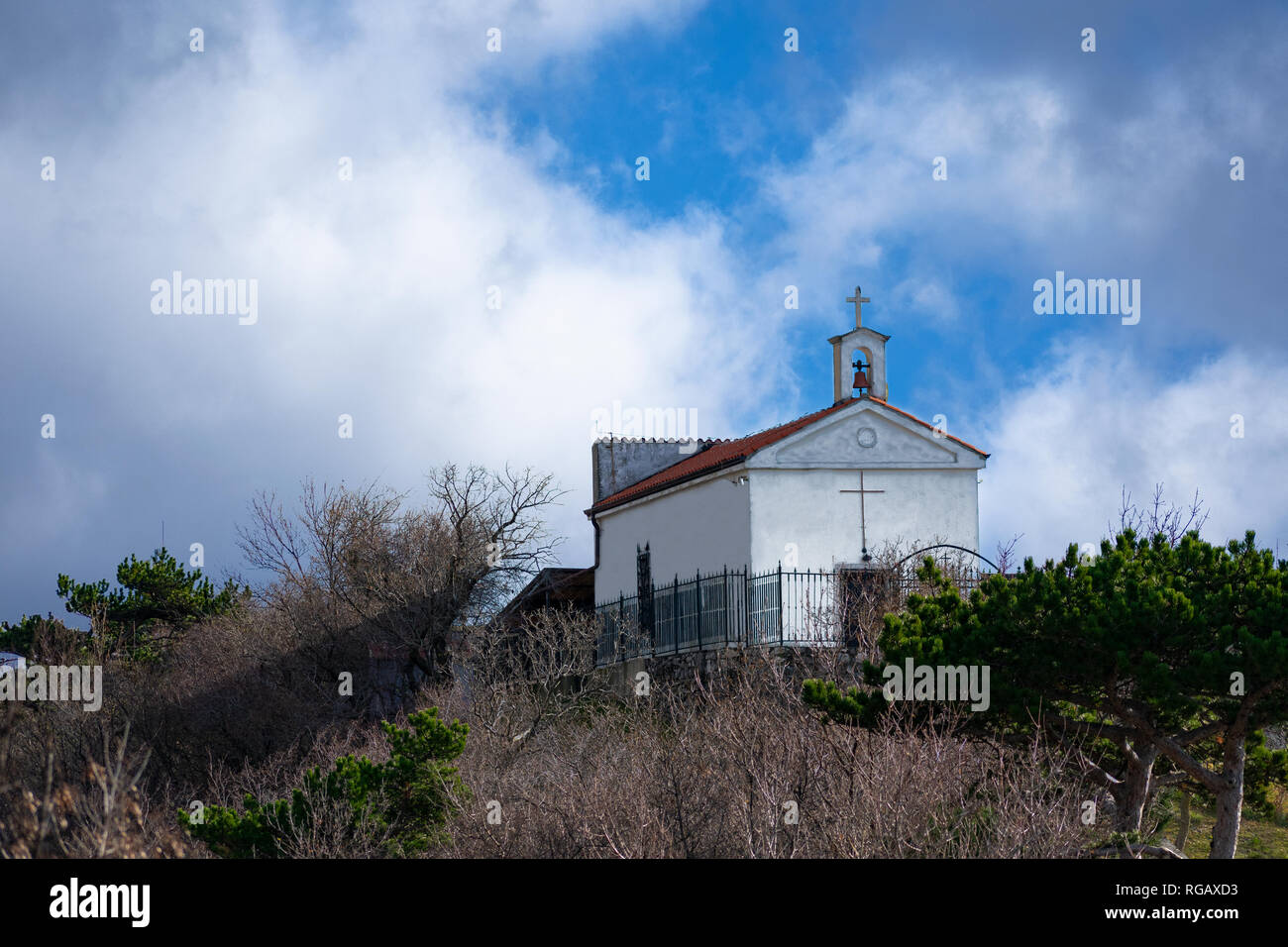Lonely Church in woods on top of a hill Stock Photo - Alamy