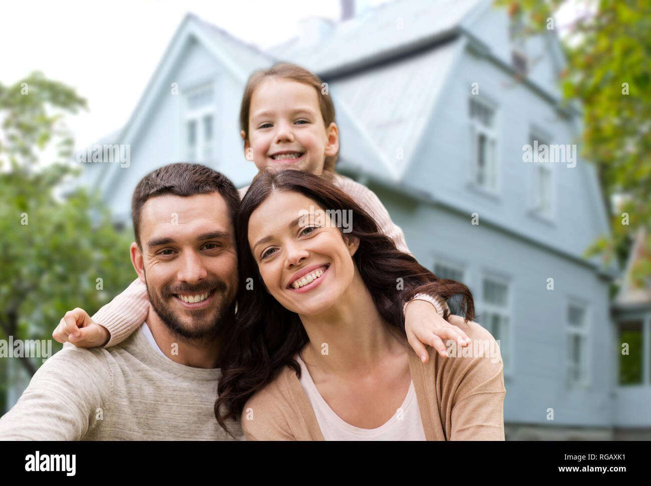 happy family over house background Stock Photo - Alamy
