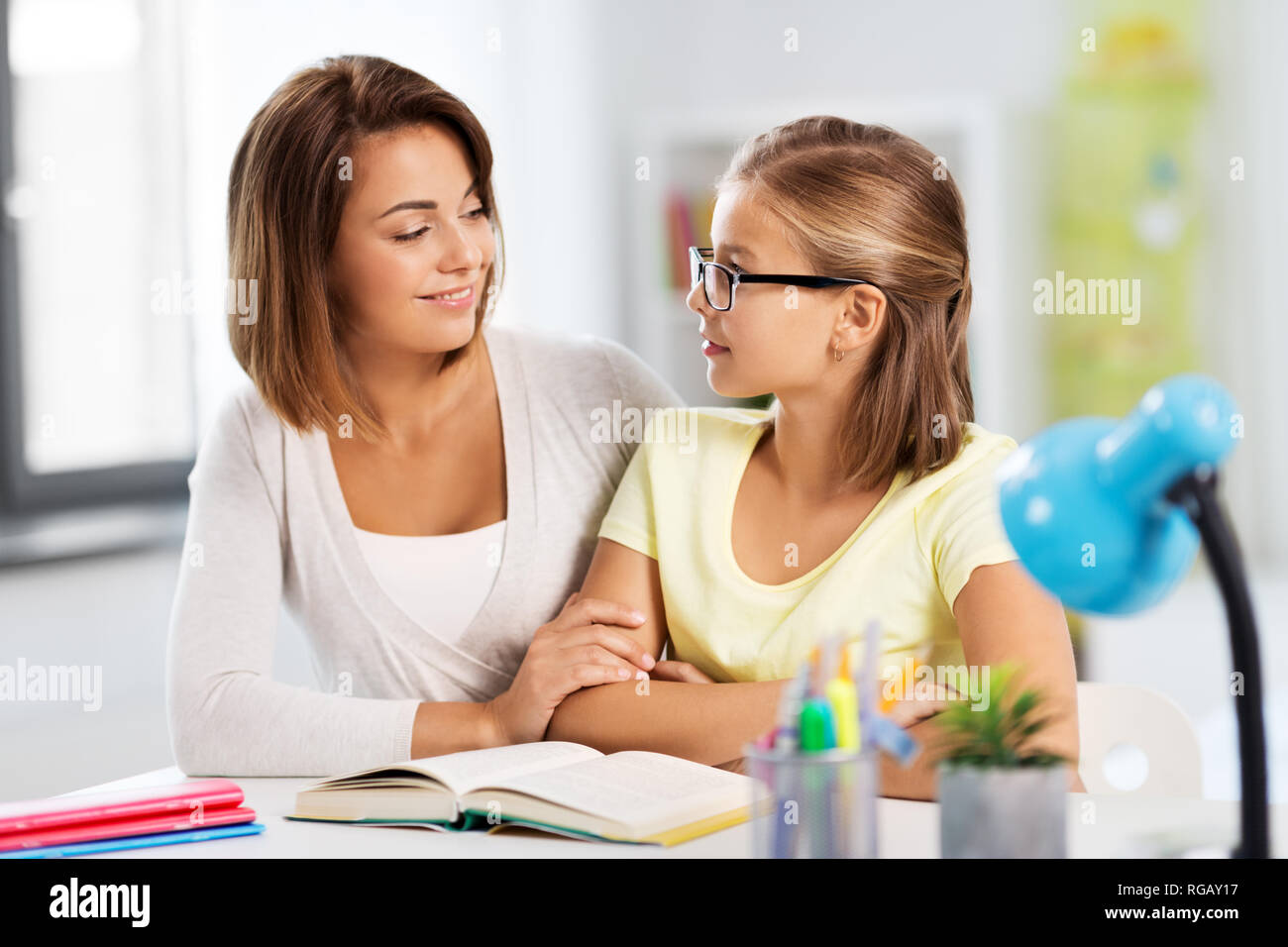 mother and daughter doing homework together Stock Photo - Alamy