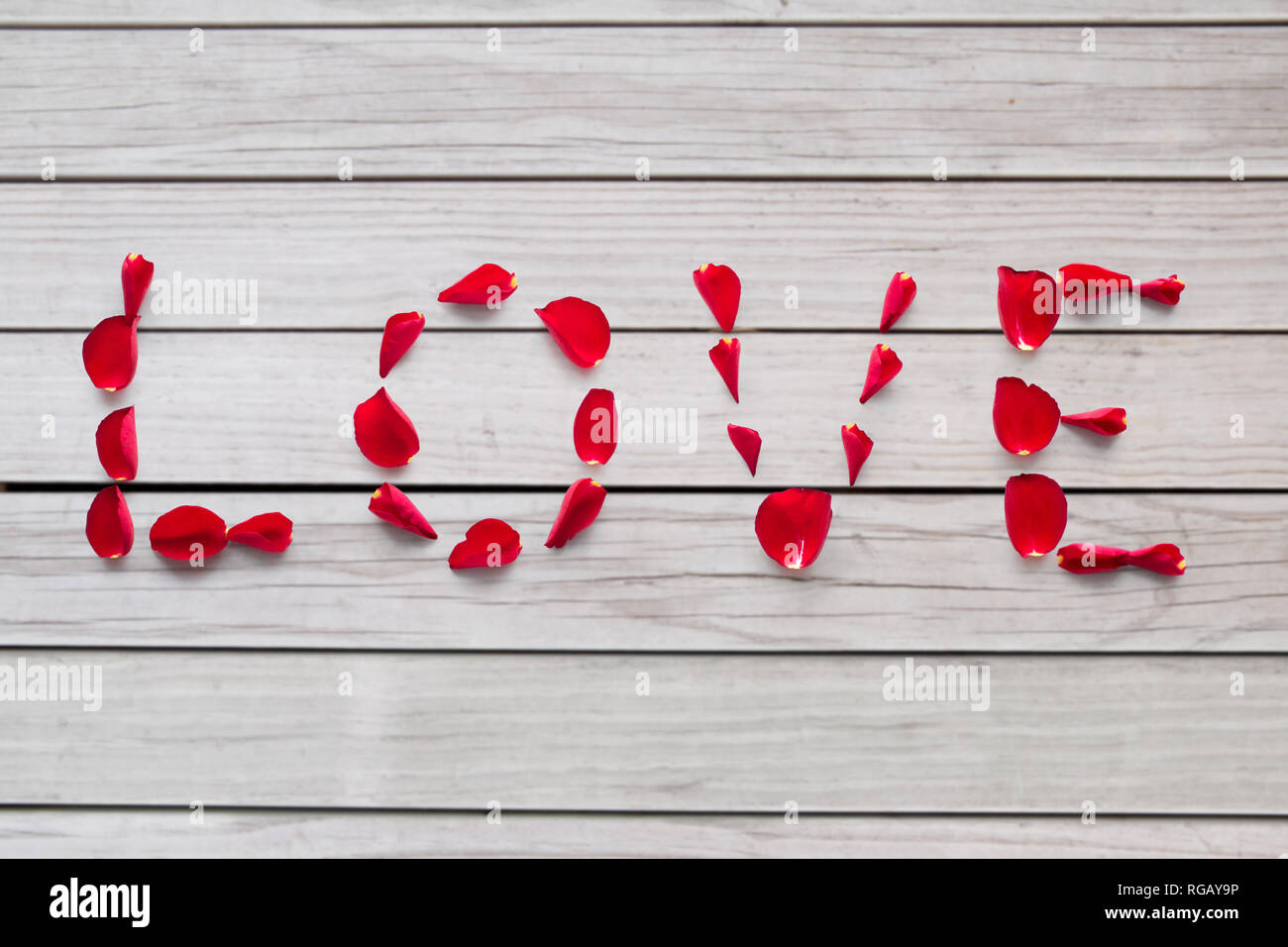word love made of red rose petals Stock Photo - Alamy