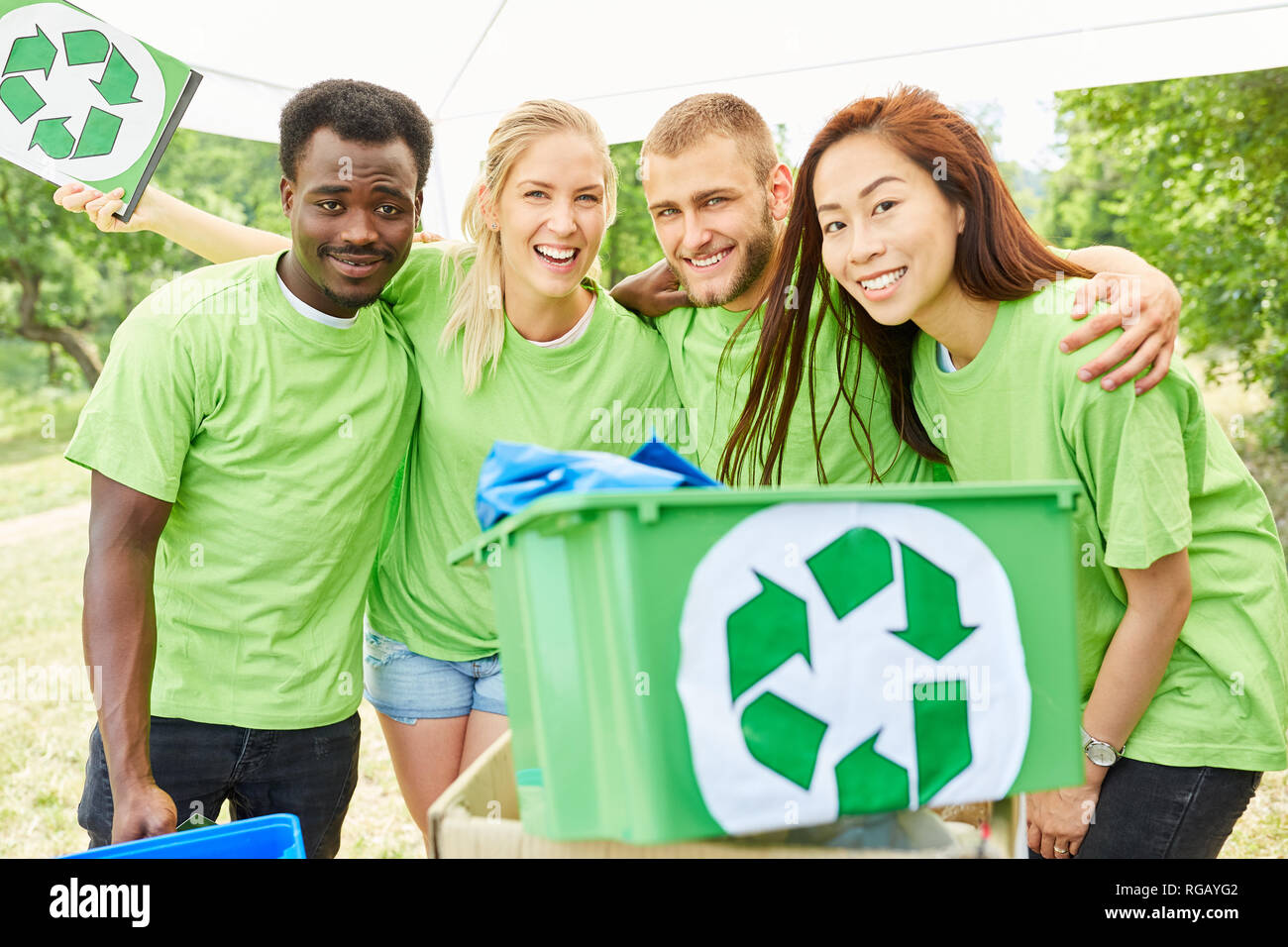 Young people as a team Volunteers collecting garbage in an ...