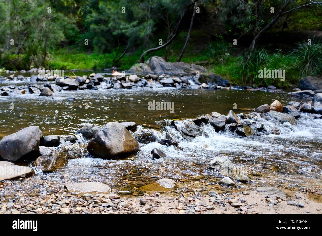 A man refreshes in Broken river, at the Bush camp at The Diggings ...