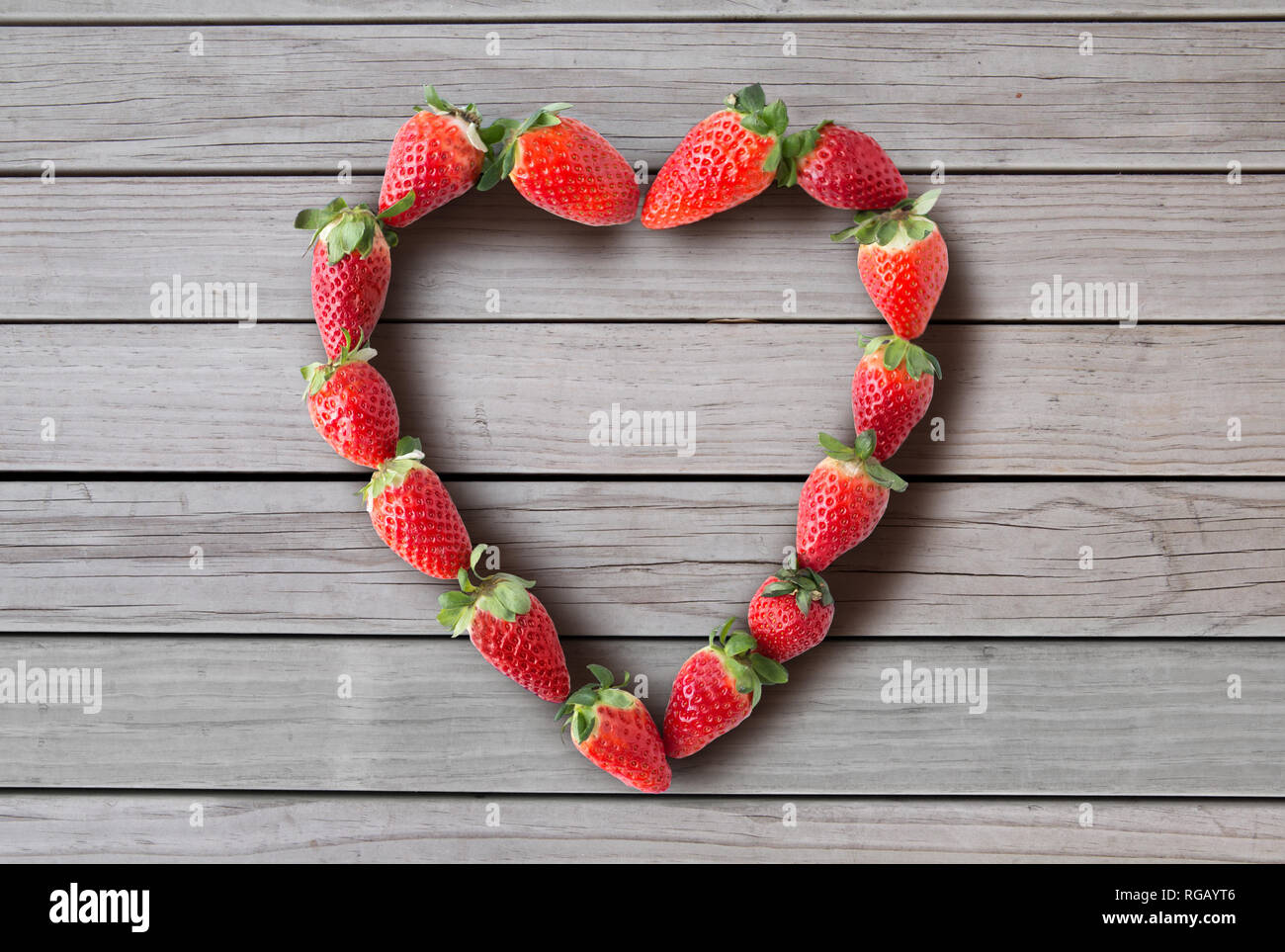 heart shaped frame made of strawberries Stock Photo - Alamy