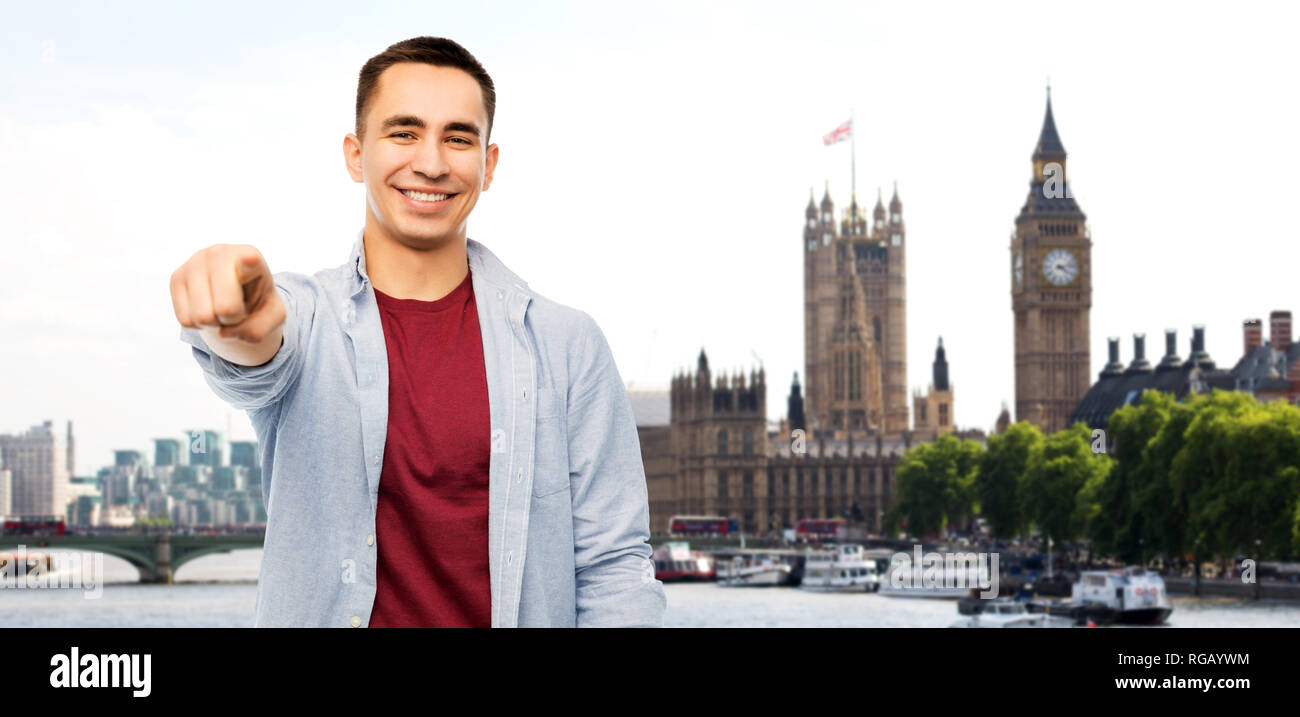 man pointing finger to you over london background Stock Photo - Alamy