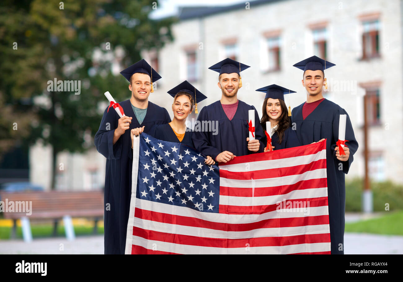 graduate students with diplomas and american flag Stock Photo - Alamy