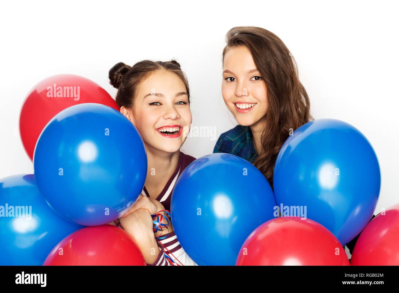 happy teenage girls with helium balloons Stock Photo - Alamy