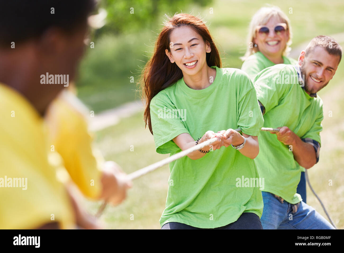 Team has fun together at the tug of war competition at the sports ...