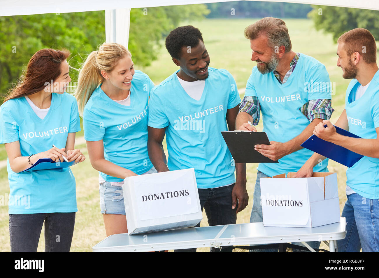 Team Volunteer Collecting Donations Volunteering for a Social Project ...