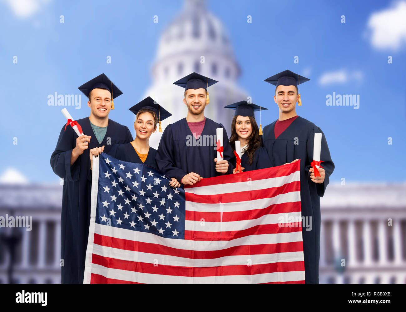 graduate students with diplomas and american flag Stock Photo - Alamy