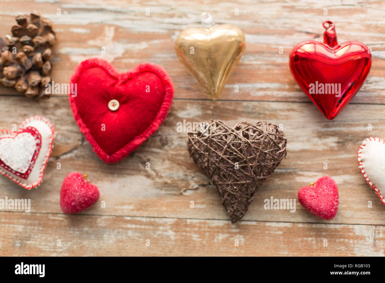 heart shaped decorations on wooden background Stock Photo - Alamy