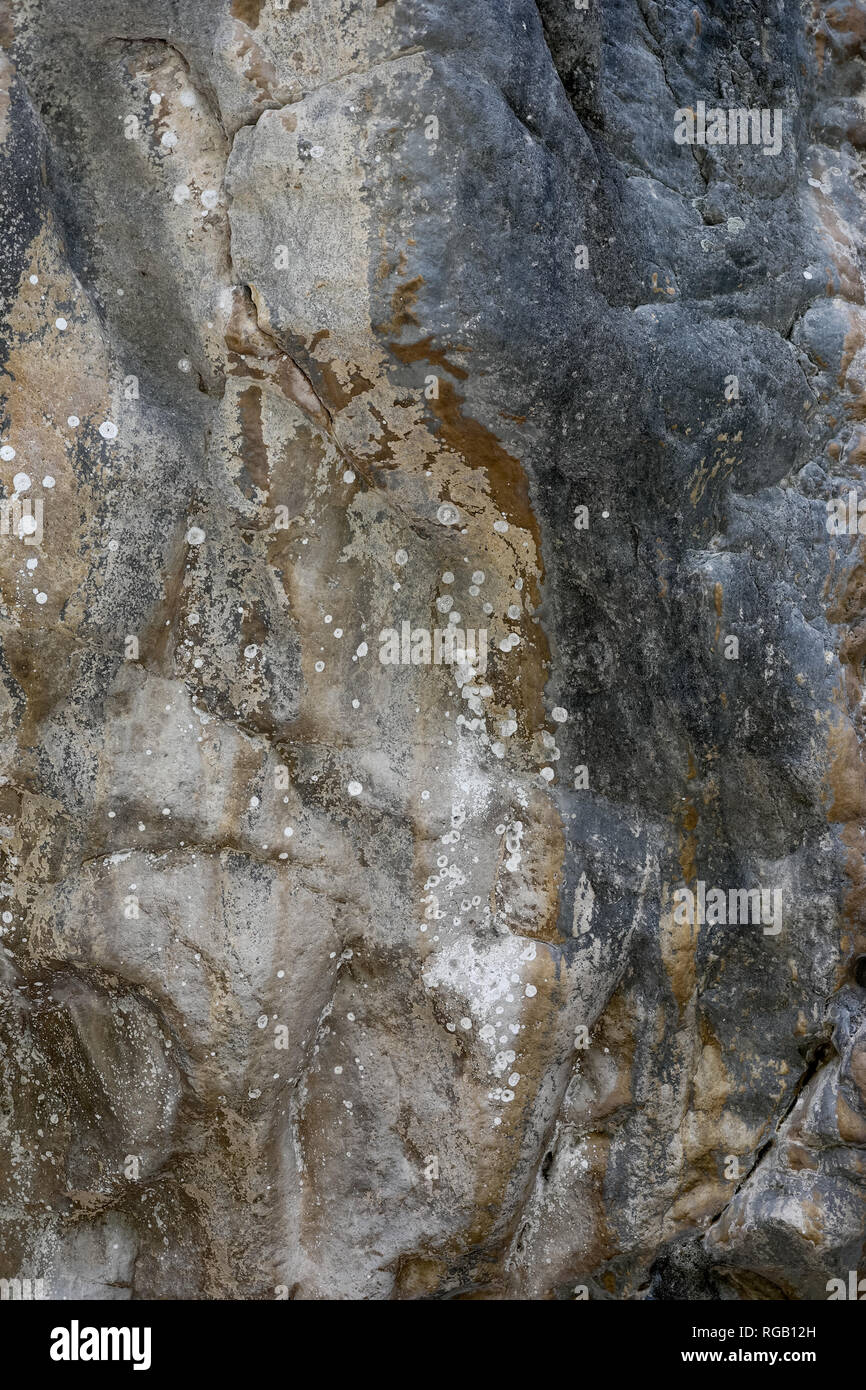 Natural stone background of rock formation with uneven bulging surface ...