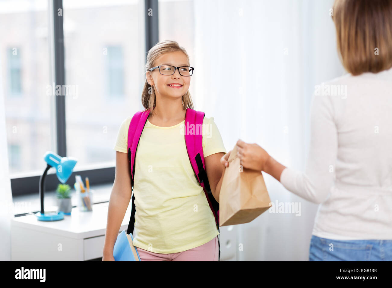Child getting home from school hi-res stock photography and images - Alamy