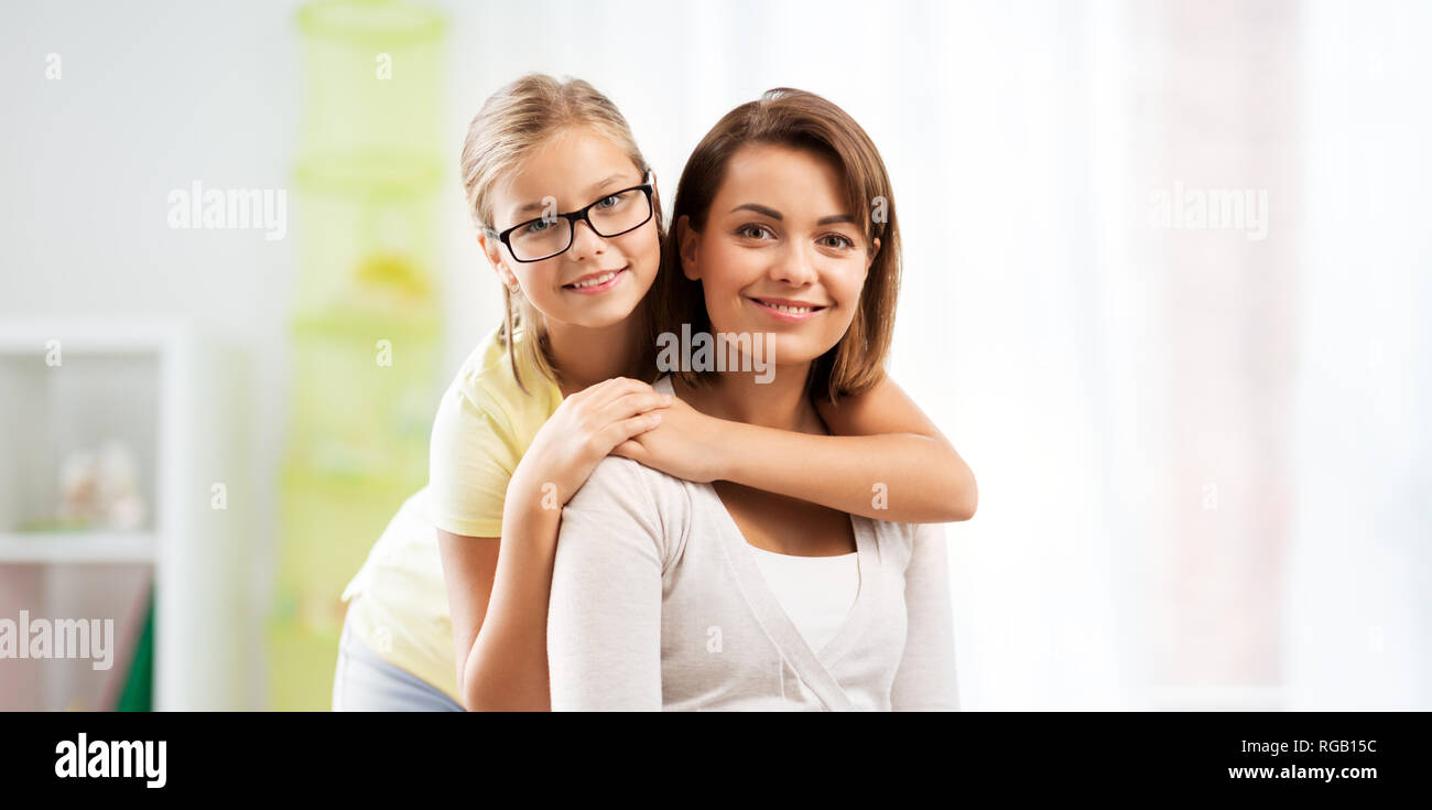 Portrait mother hugging daughter at home hi-res stock photography and images - Alamy