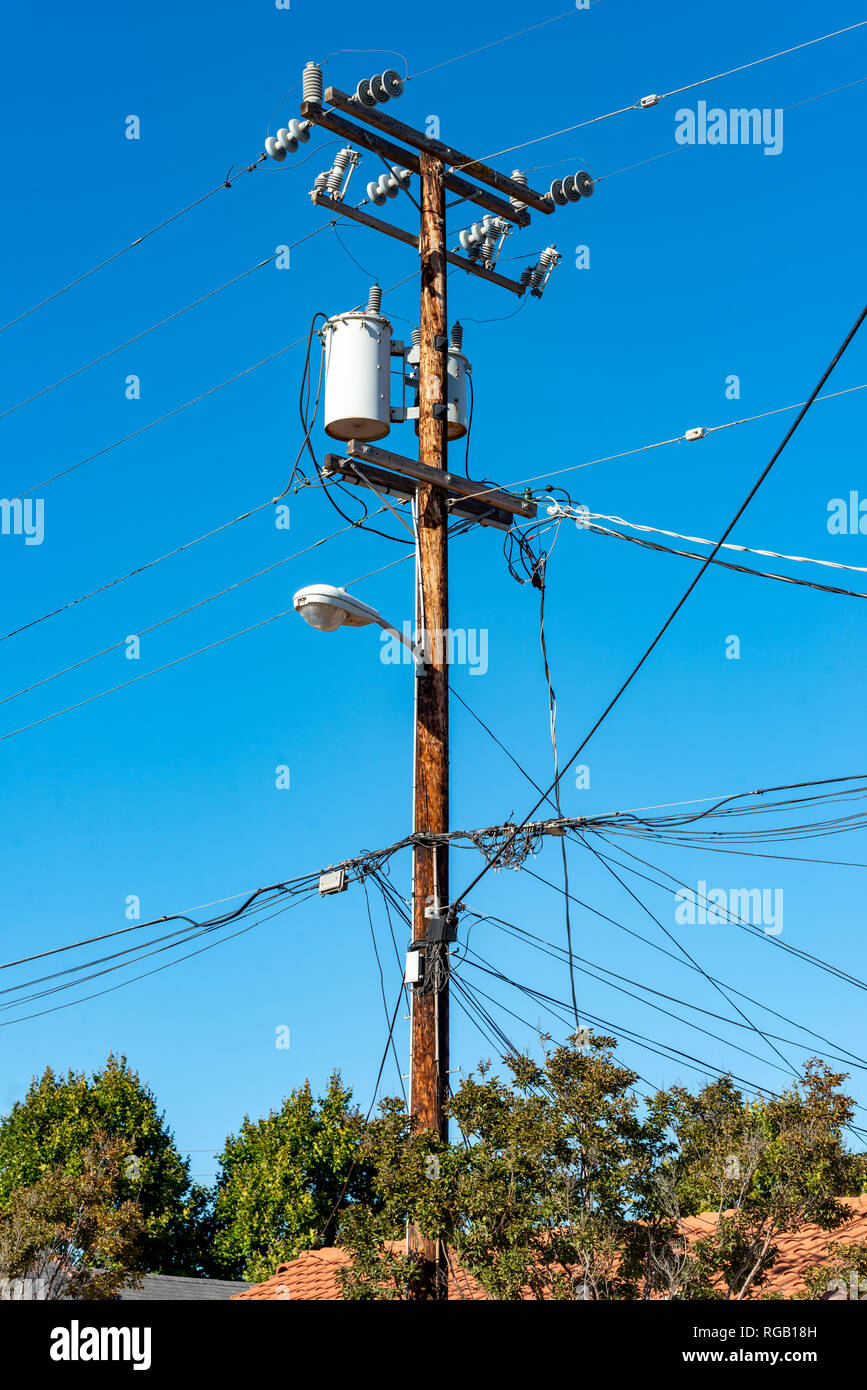 electricity pole with street lamp Stock Photo - Alamy