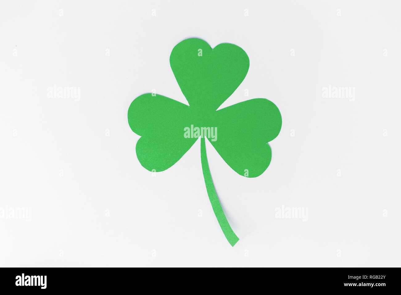 green paper shamrock on white background Stock Photo - Alamy