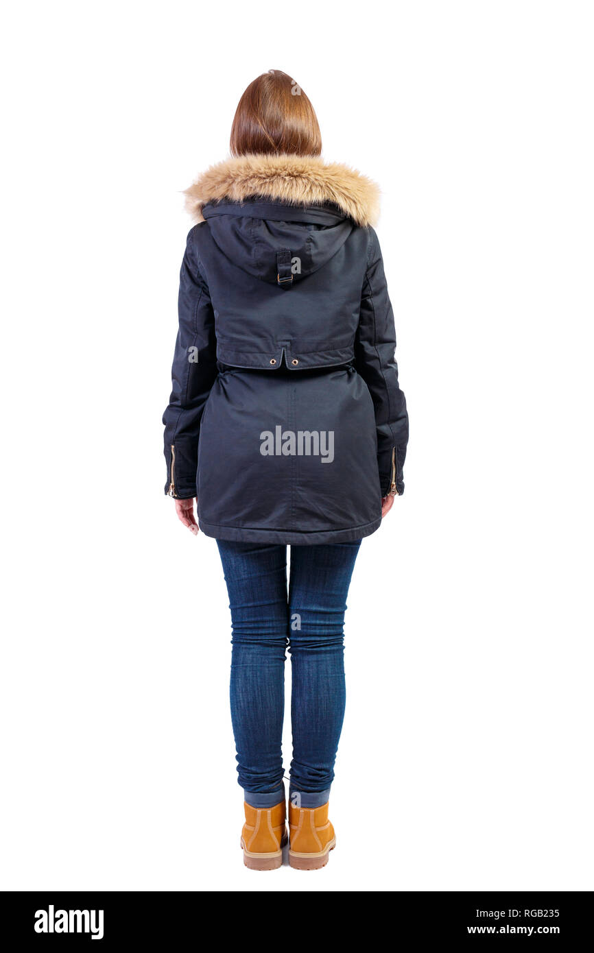 Back view woman in black winter jacket looking up. Standing young girl ...