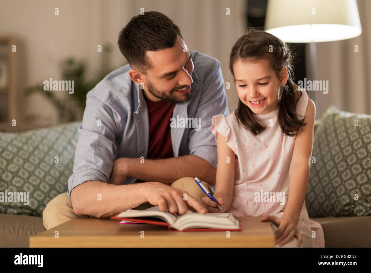 father and daughter doing homework together Stock Photo - Alamy