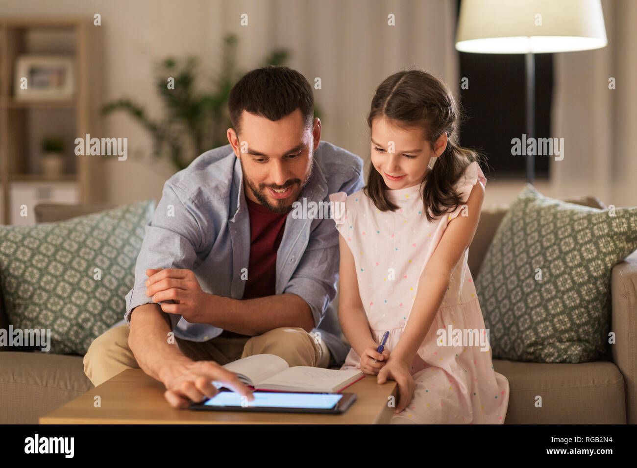 father and daughter doing homework together Stock Photo - Alamy