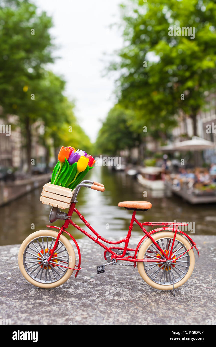 Red dutch miniature bicycle with cute details at Amsterdam canal ...