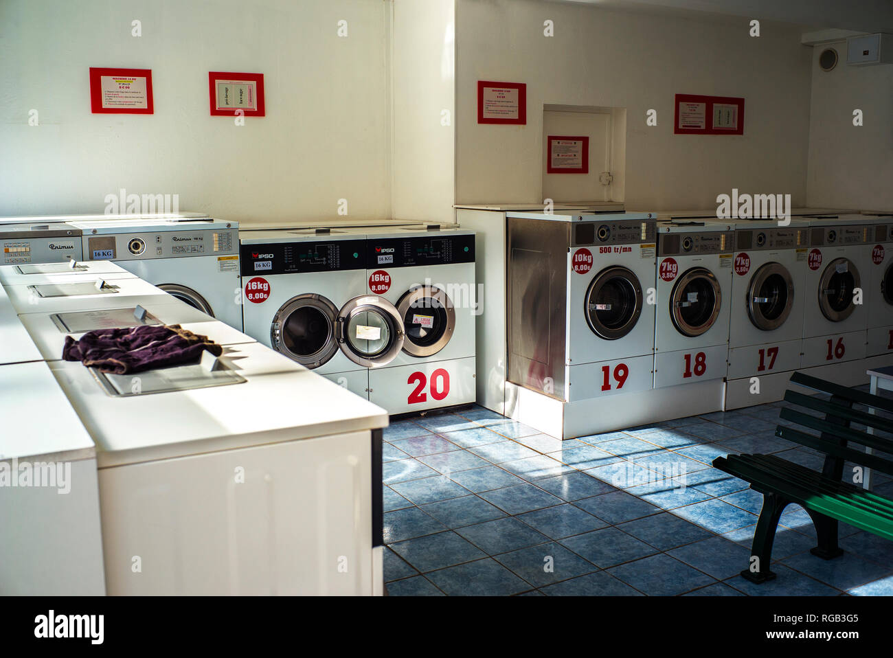 public laundromat empty interior Stock Photo - Alamy