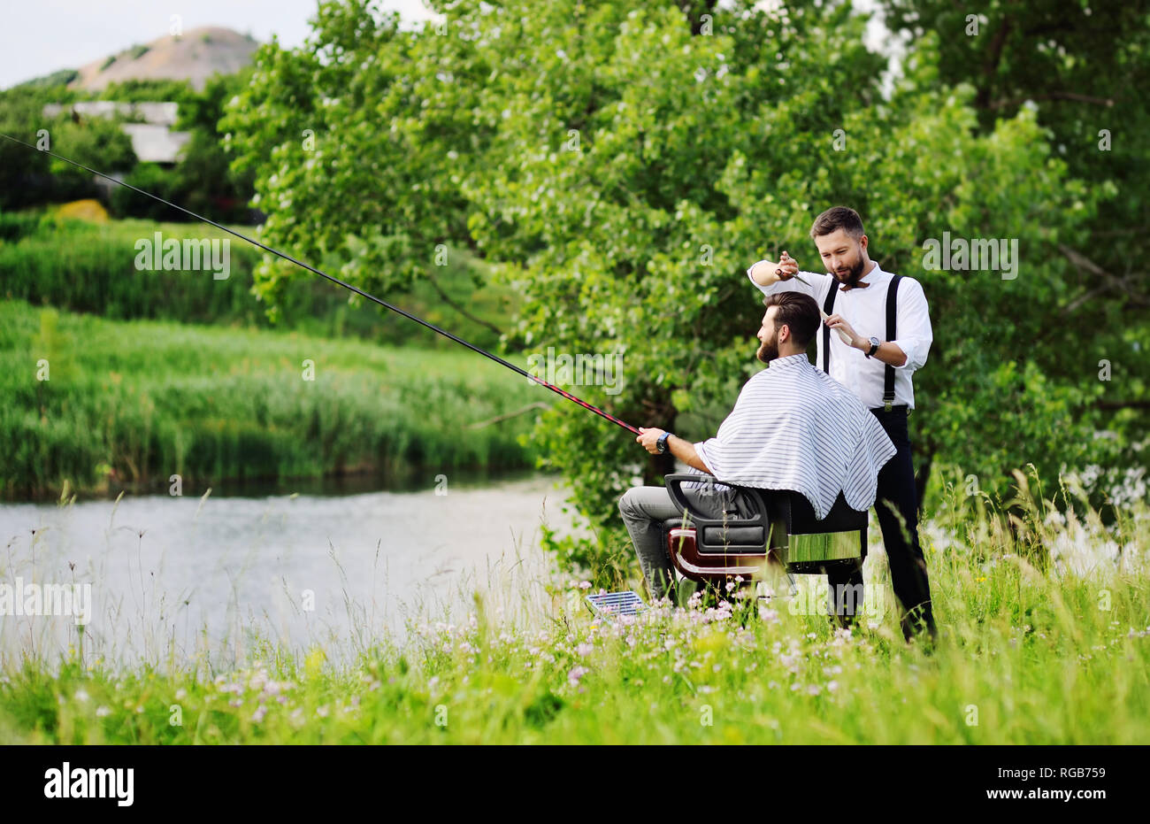 Hands holding fishing rod river hi-res stock photography and images - Alamy