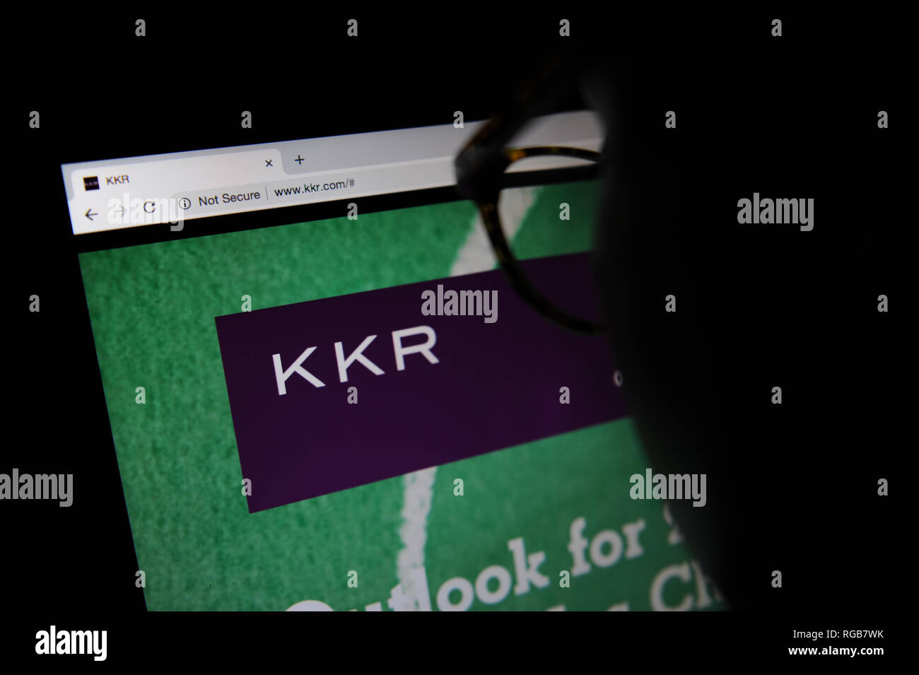 The private equity firm KKR & Co. Inc website seen through a magnifying ...