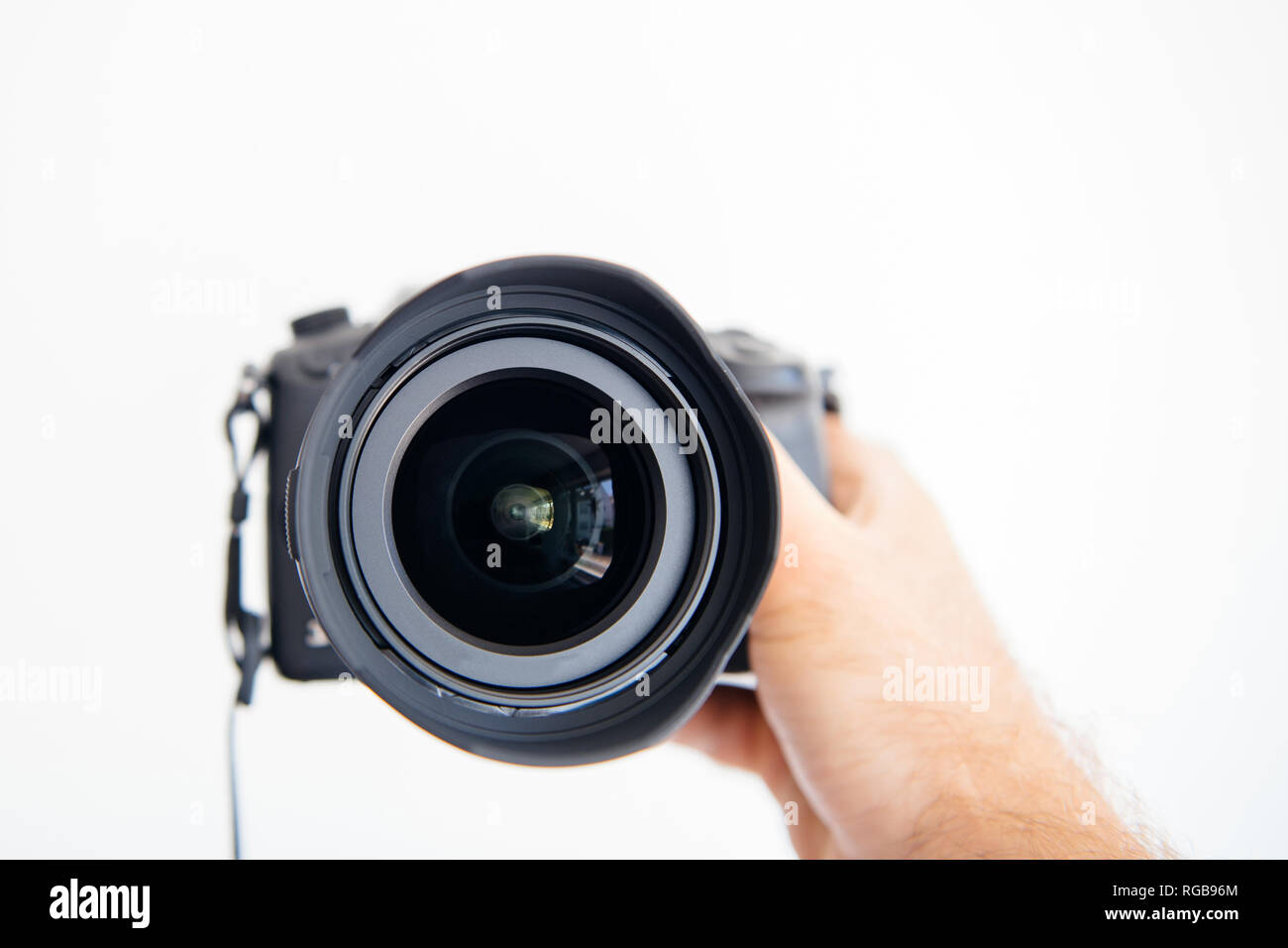 New ultra wide mirrorless camera in male hand Stock Photo - Alamy