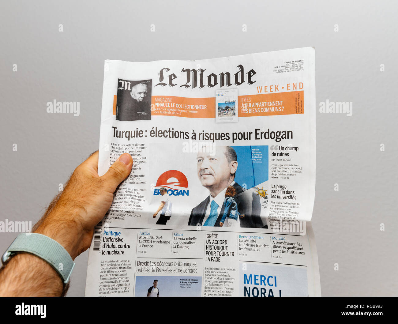 PARIS, FRANCE - JUL 1, 2018: Man POV at Le Monde Newspaper with face of ...
