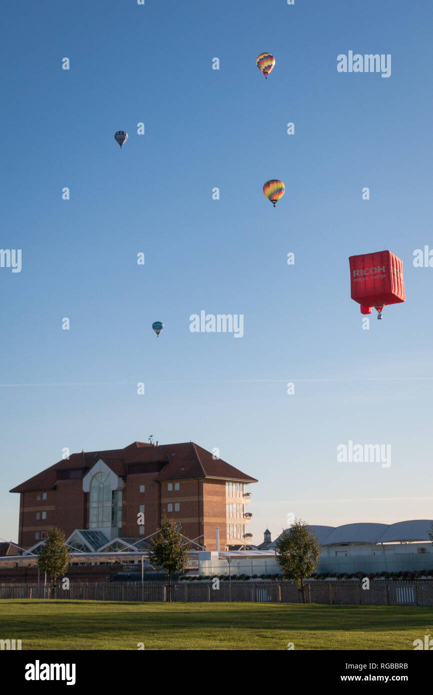 Hot air balloons drift over York racecourse during the York Balloon ...