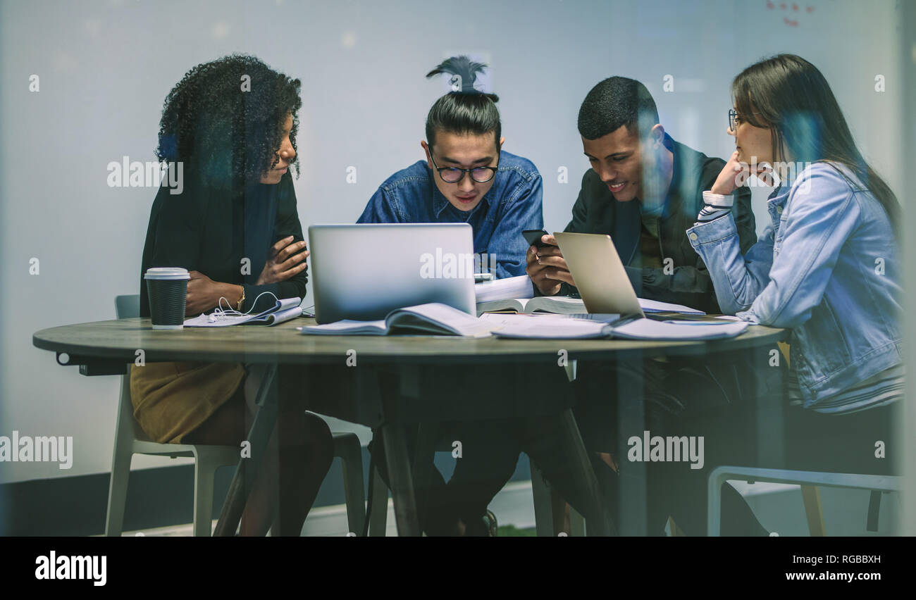 Multiracial group of young students studying together. Young people ...