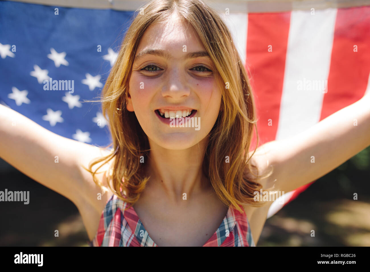 Girl behind flag hi-res stock photography and images - Alamy