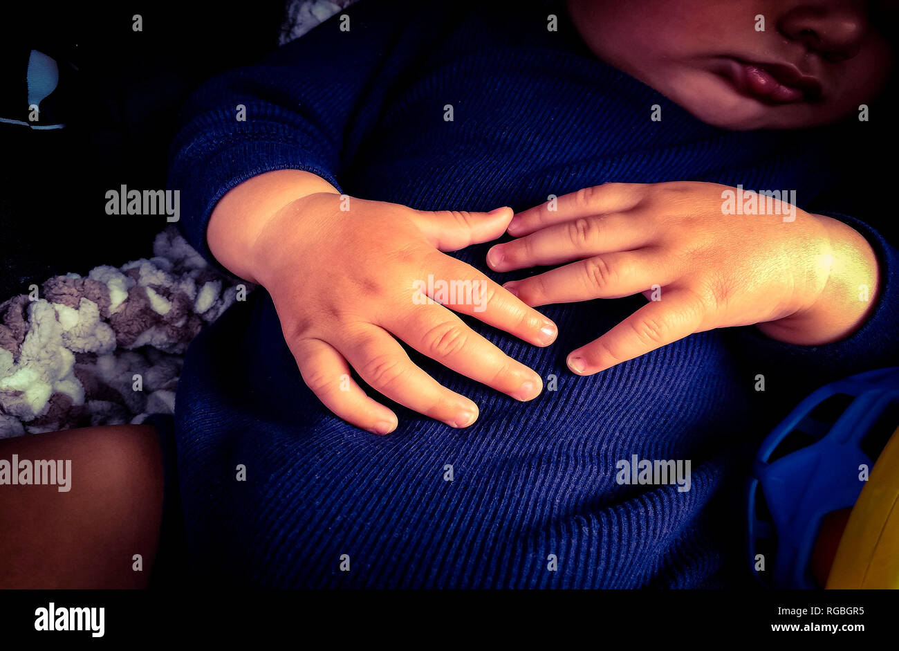 A toddler's relaxed hands indicate deep sleep and contentment, Nova ...