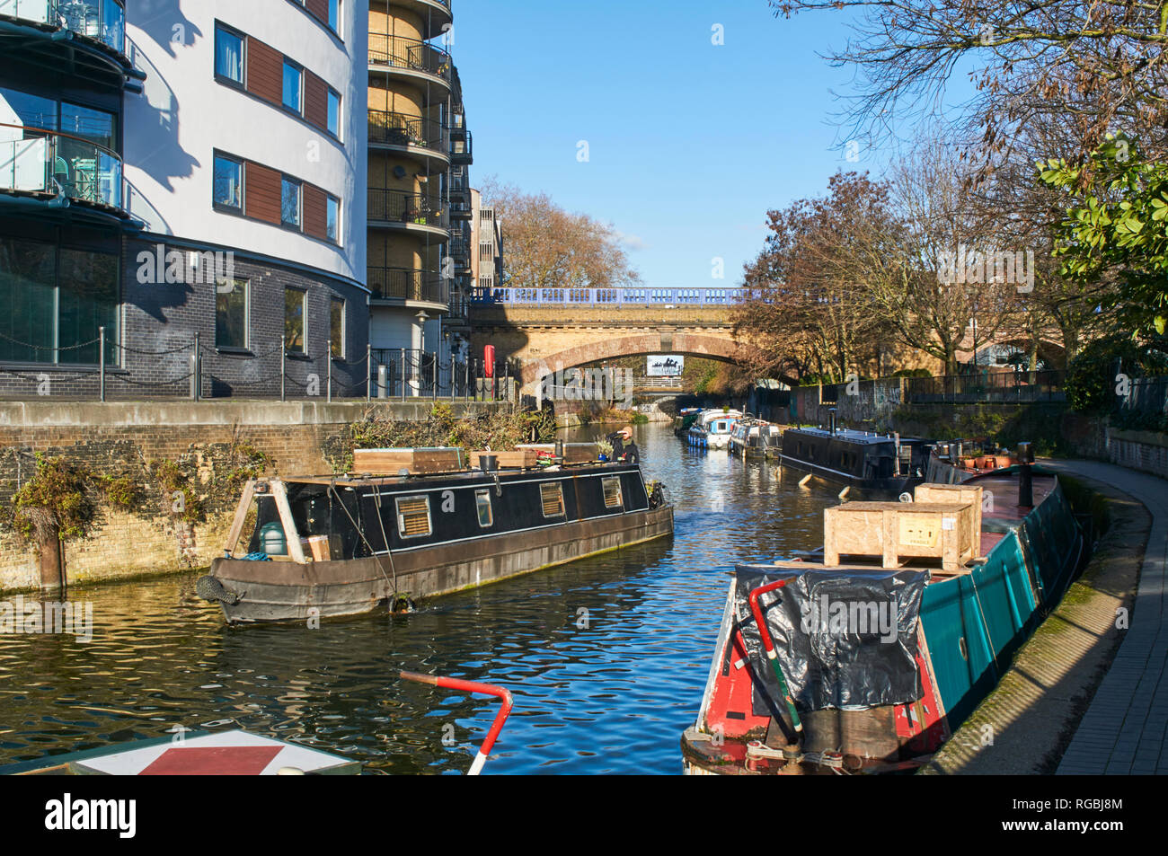 Limehouse Cut, in London's East End, with canal traffic and new ...